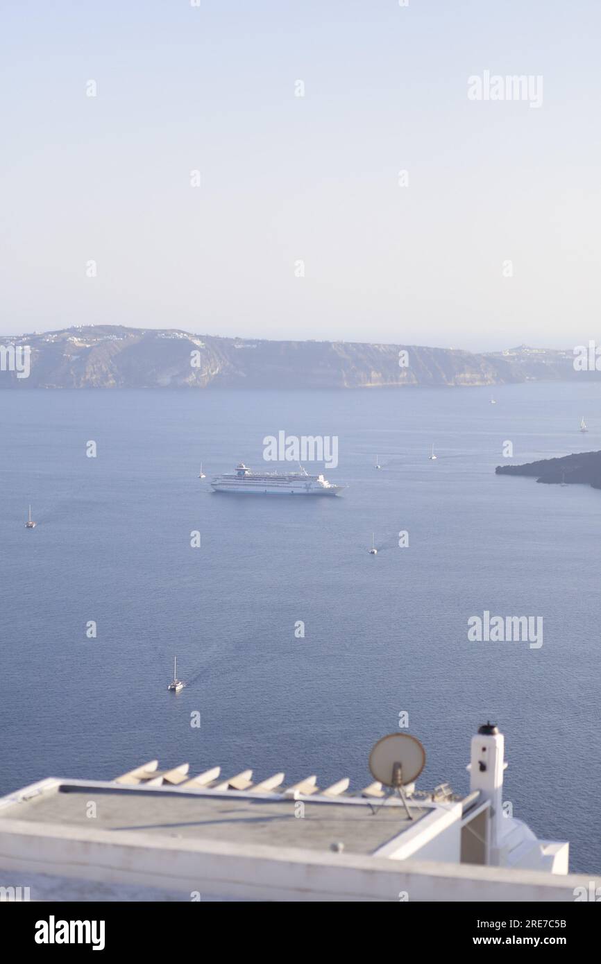 Cruisers and boats sailing in the shore waters of Santorini, Greek ...