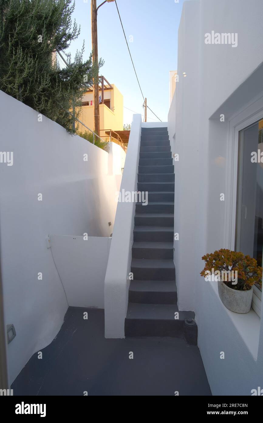 Grey Steps stairs on a domestic patio balcony white wall house Stock ...