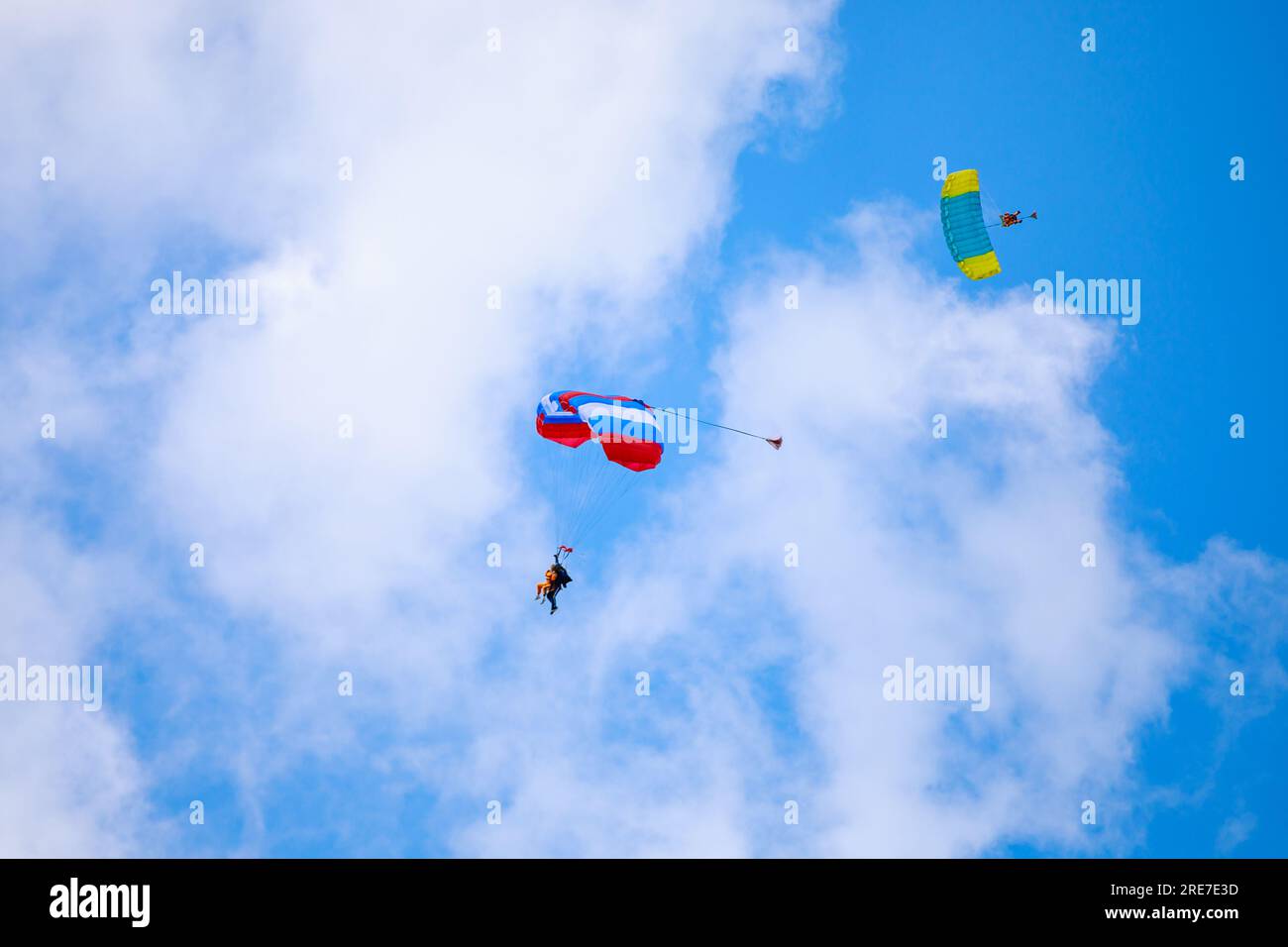 Parachute in the sky. Skydiver is flying a parachute in the blue sky ...