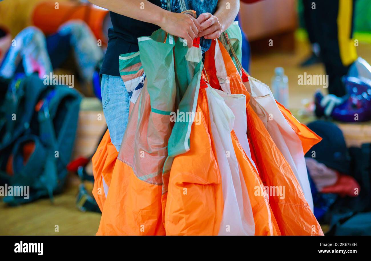 Packing a parachute into a backpack. High quality photo Stock Photo - Alamy
