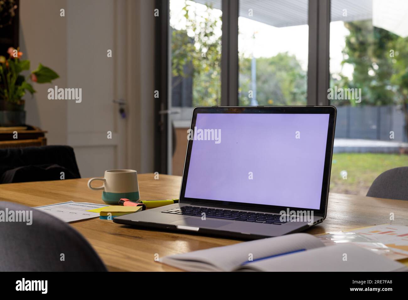 Laptop with copy space on screen on table in dining room Stock Photo ...