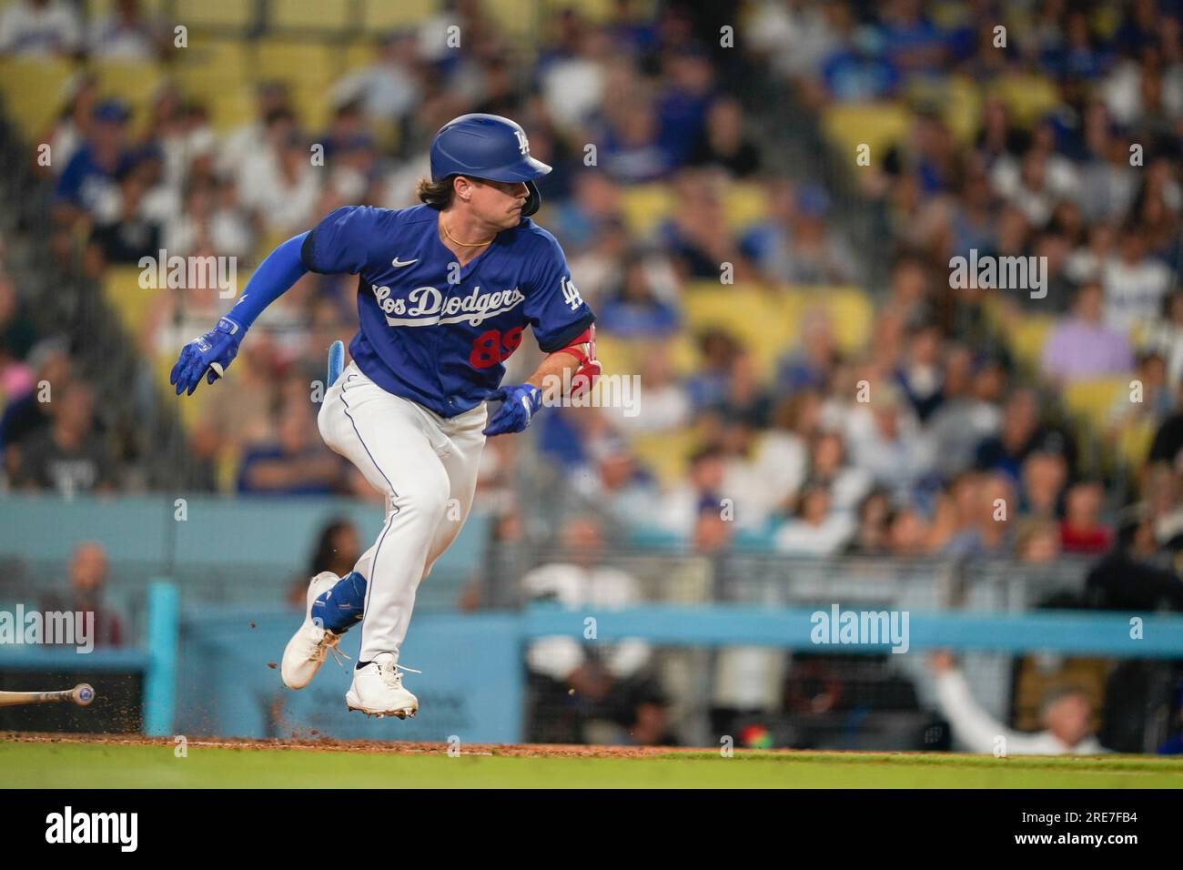 Los Angeles Dodgers left fielder Jonny Deluca (89) runs after grounding ...