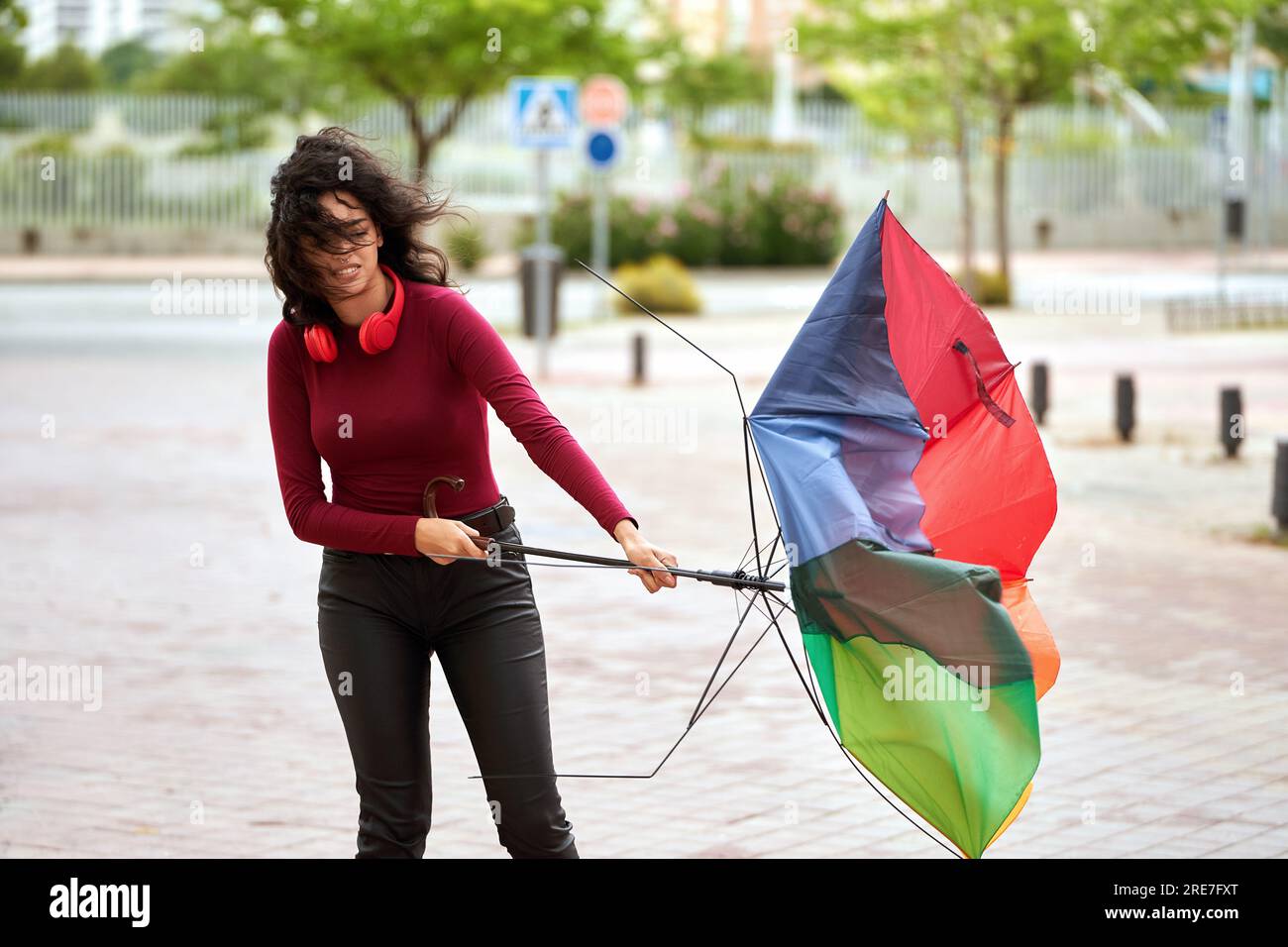 Woman fighting with umbrella hi-res stock photography and images - Alamy