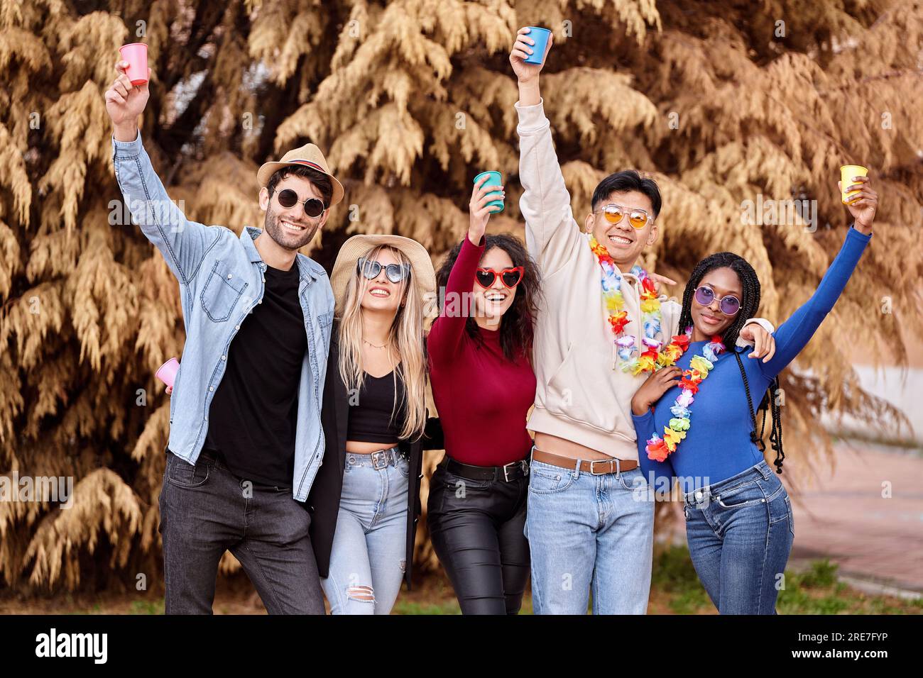 Happy group of multi-ethnic friends having fun while partying at an ...