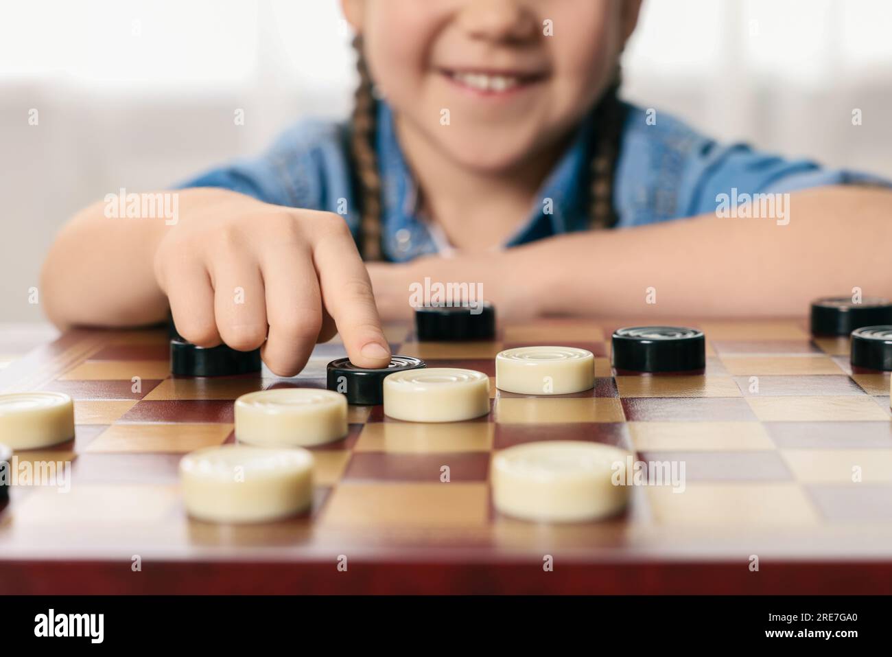 Girl learning checkers hi-res stock photography and images - Alamy