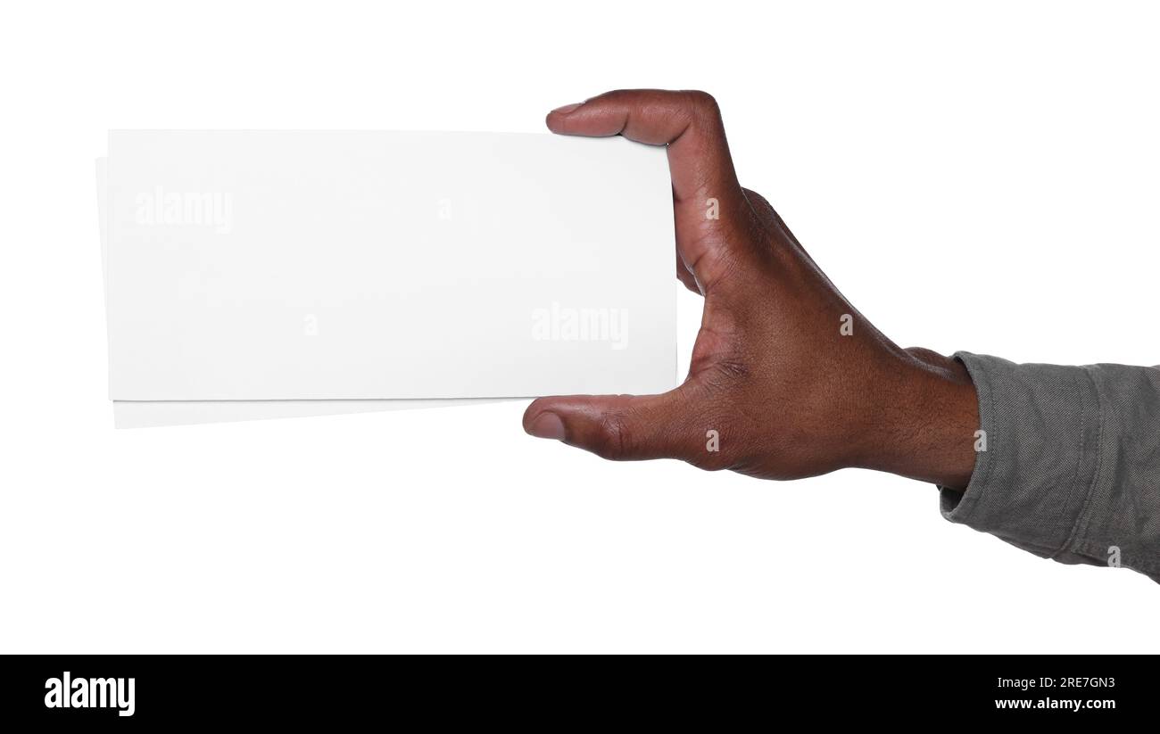 African American man holding flyers on white background, closeup ...