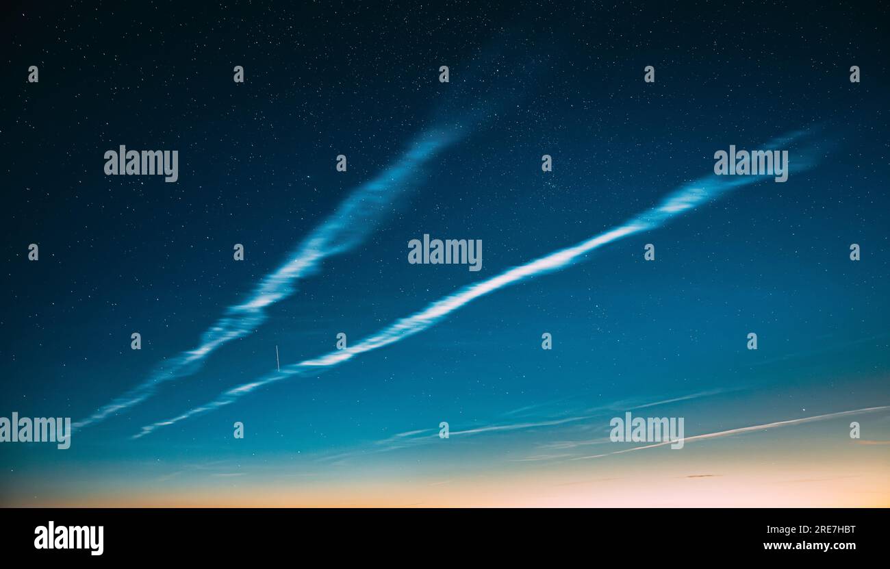 Night Starry Sky And Noctilucent Clouds Above Summer Meadow Landscape ...
