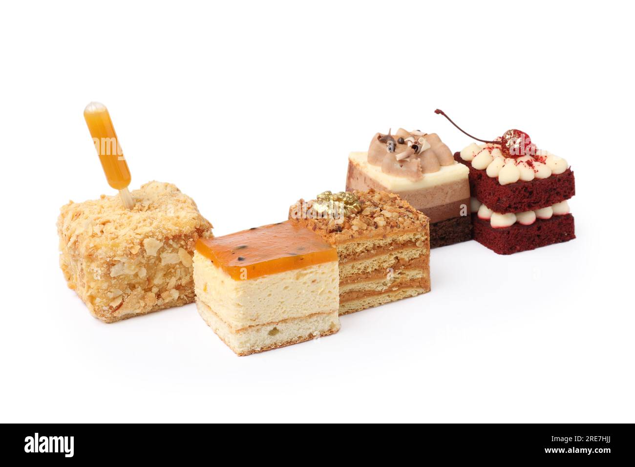 Pieces of different cakes on white background Stock Photo - Alamy