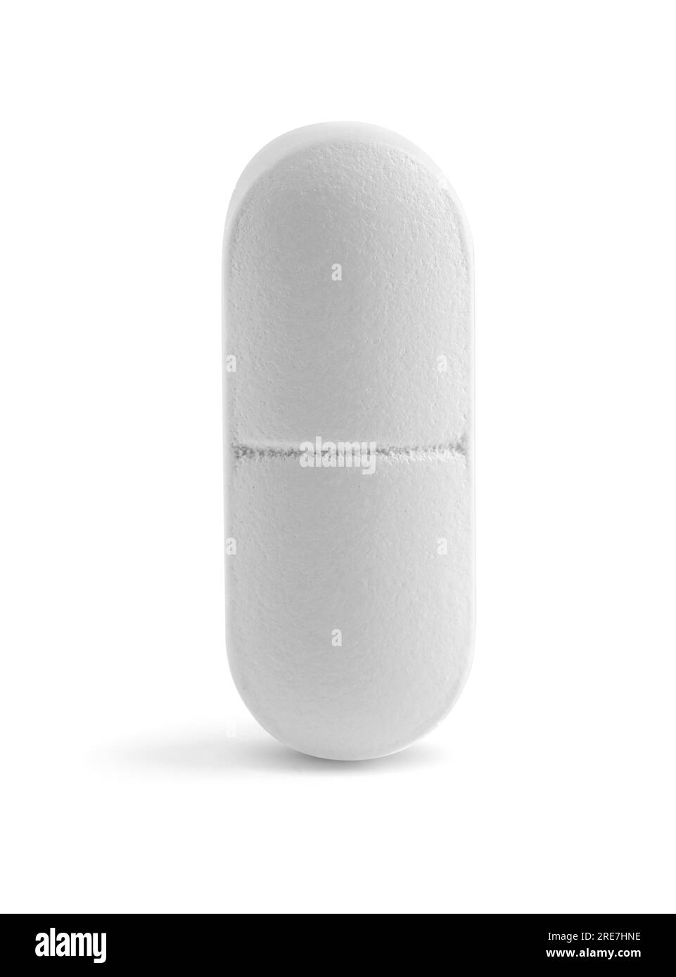 One pill on white background. Medicinal treatment Stock Photo - Alamy