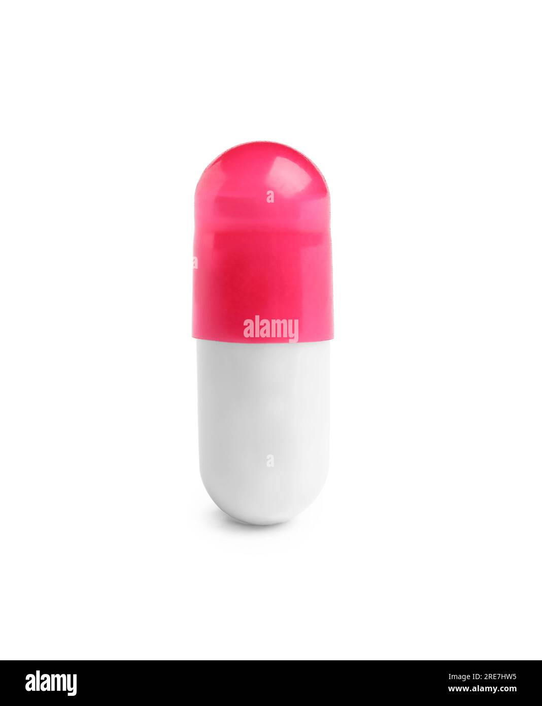 One pill on white background. Medicinal treatment Stock Photo - Alamy