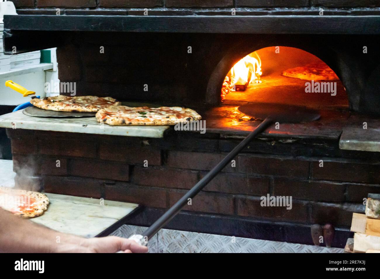 Classic Pizzeria in Naples, Italy with Wood Fired Over and Brown Brick ...