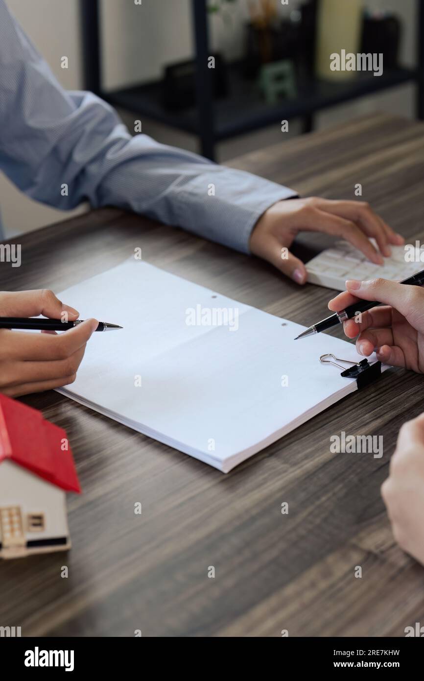 Real Estate Agent explain insurance and agreement contract to client ...