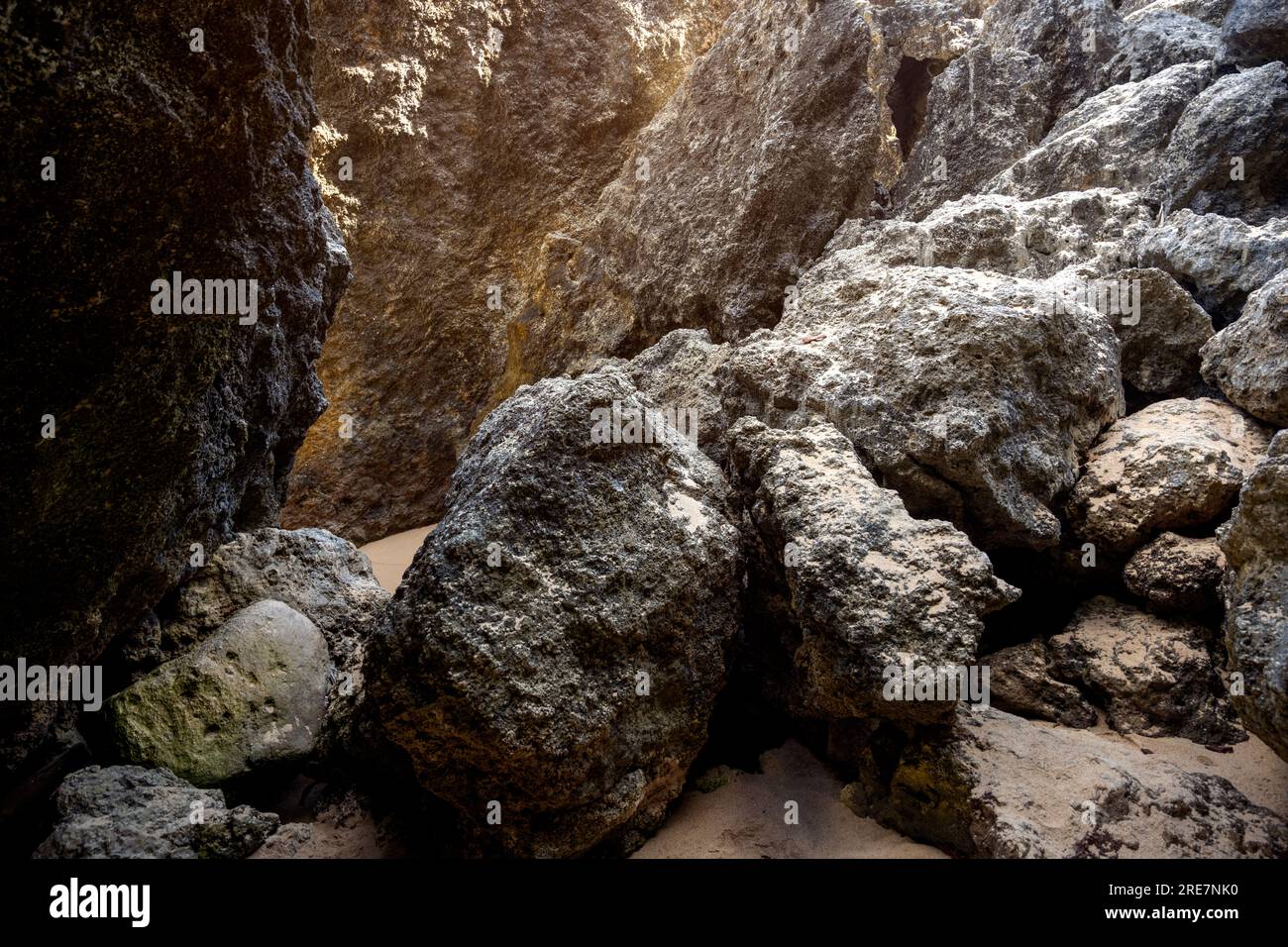 Stack of rocks on the sandy beach with sunlight background Stock Photo ...