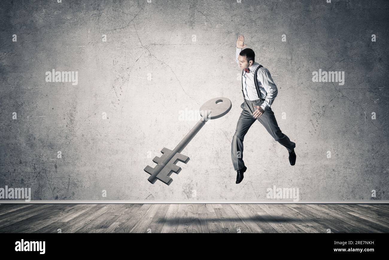 Breaking through access concept with man in room crashing concrete key ...