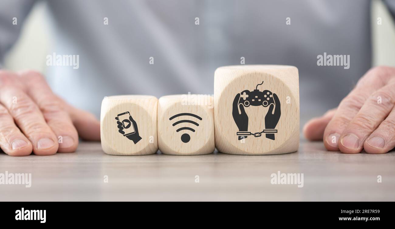 Wooden blocks with symbol of video game addiction concept Stock Photo ...