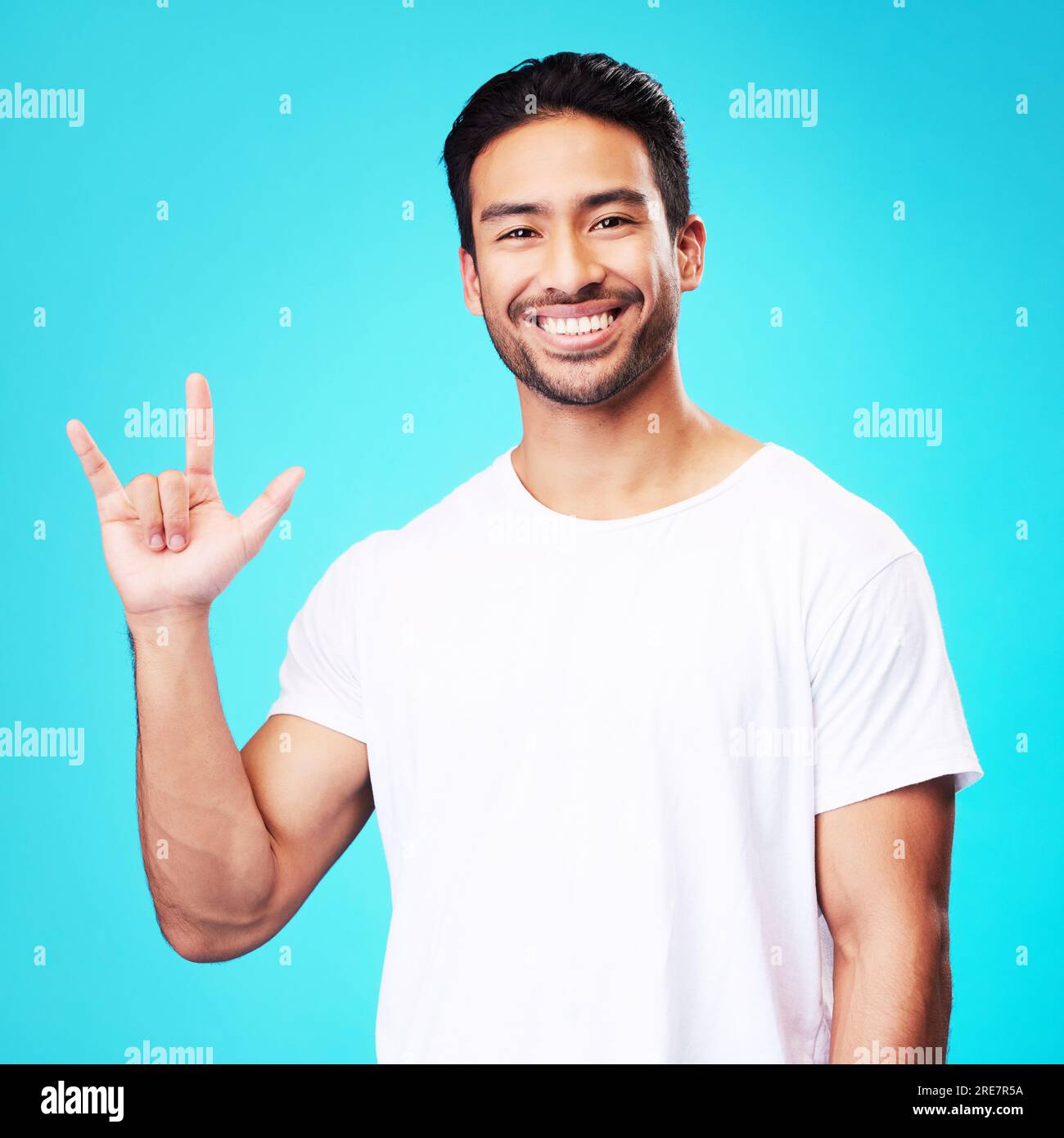 Man, horns and love in studio portrait with smile, kindness and sign ...