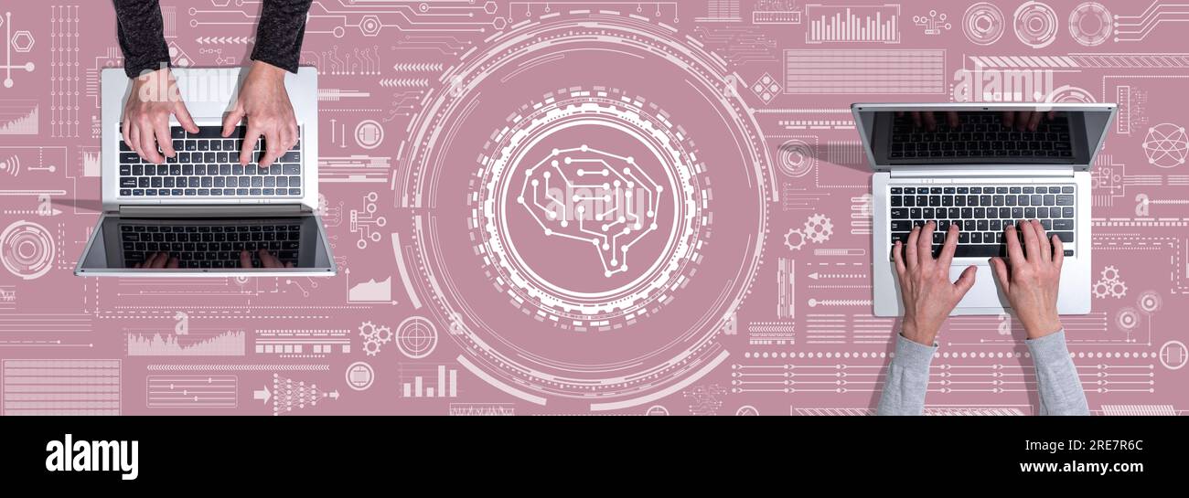 Top view of hands using laptop with symbol of machine learning concept ...