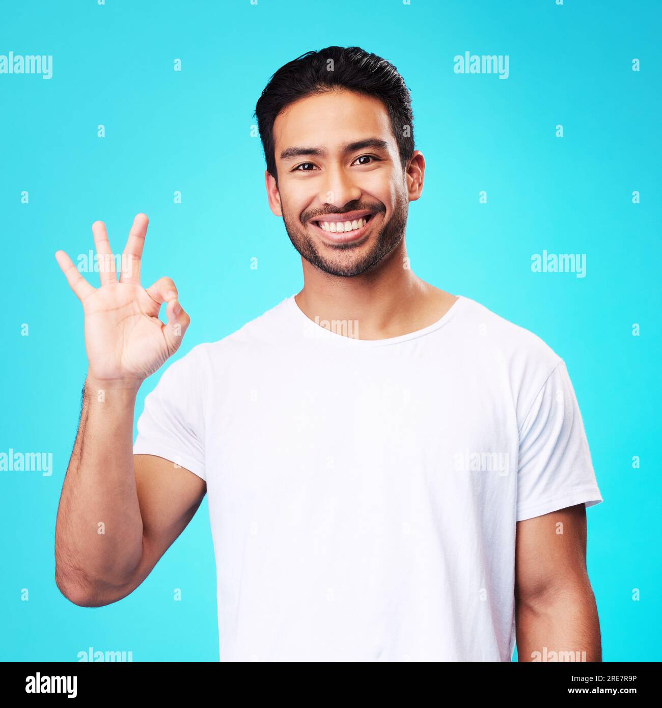 Happy, perfect gesture and portrait of a man in a studio with an ...