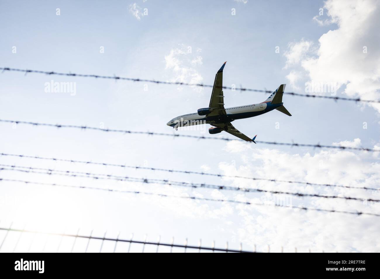 An airplane lands at Duesseldorf International Airport behind a ...