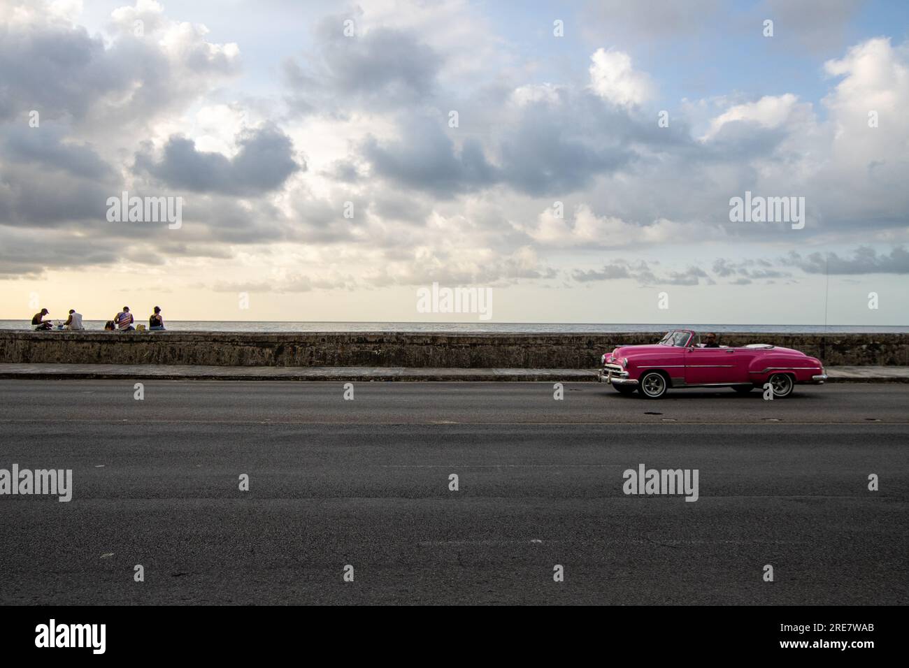 Cuban old vintage ping car driving on the Malecon in La Havana. Tourist ...