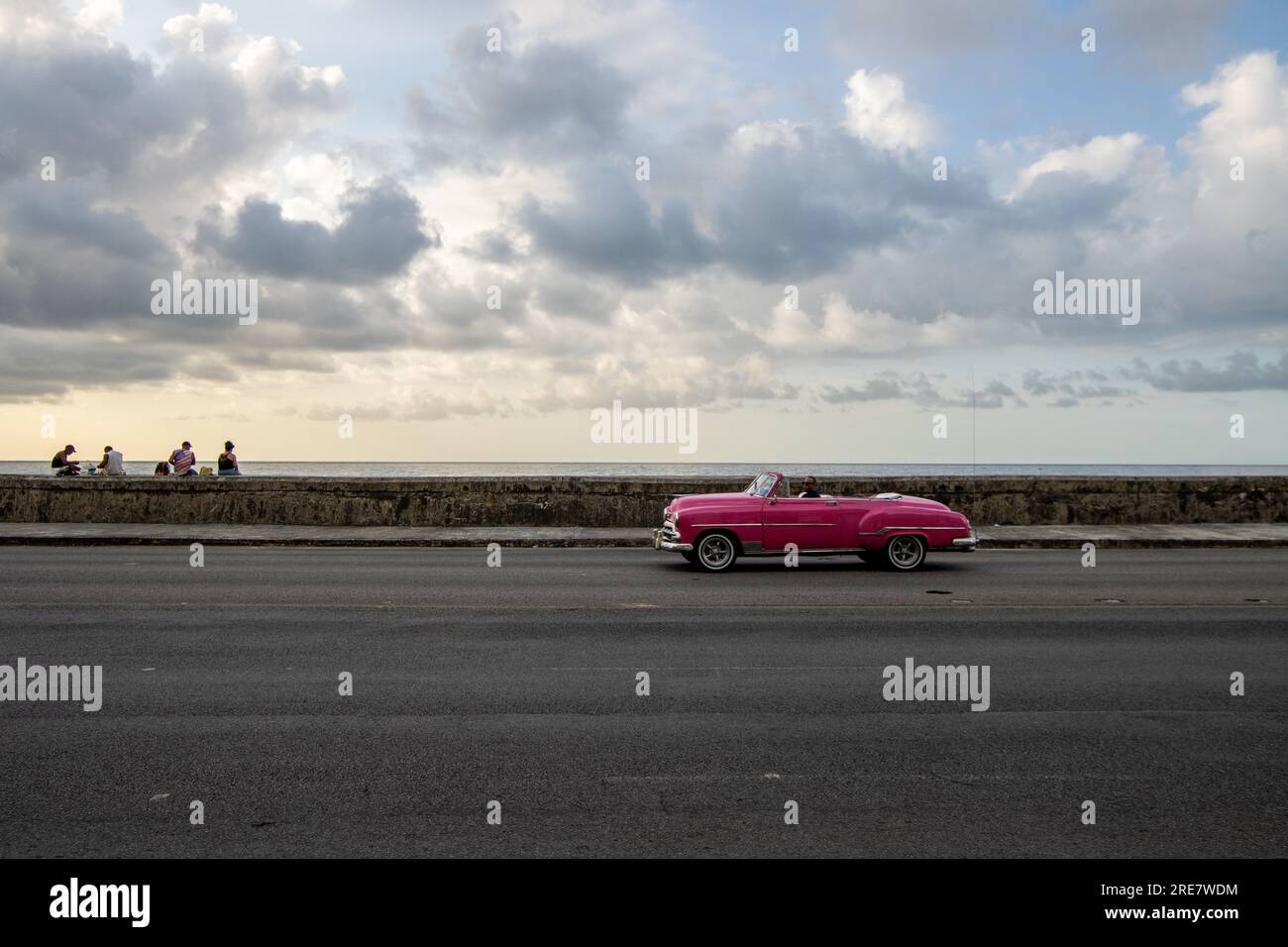 Cuban old vintage ping car driving on the Malecon in La Havana. Tourist ...
