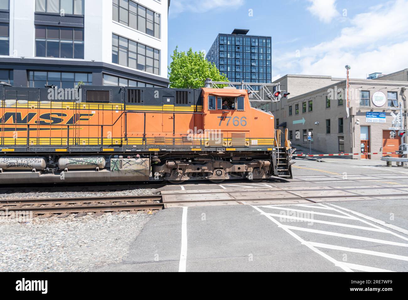 BNSF freight train on a level crossing from Alaskan Way, Seattle, USA ...