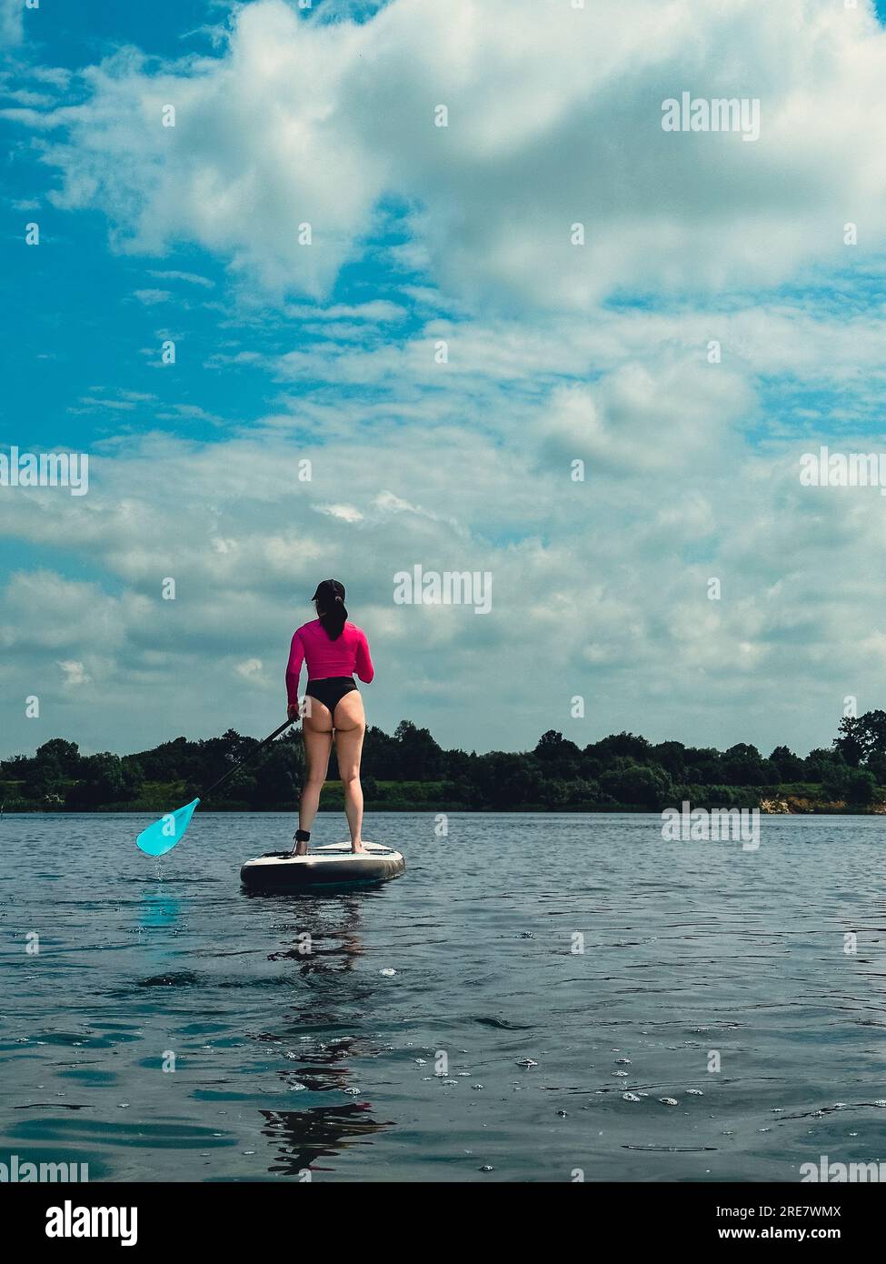 beautiful woman standing on supboard keep balance Stock Photo - Alamy