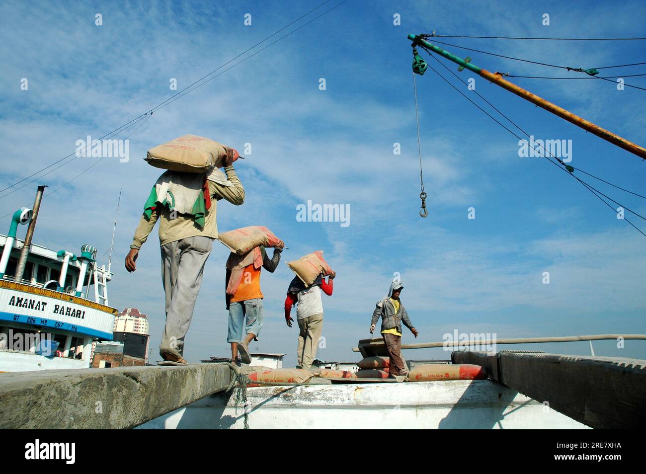 Jakarta, Indonesia - May 29, 2010 : Laborers are transporting cement ...