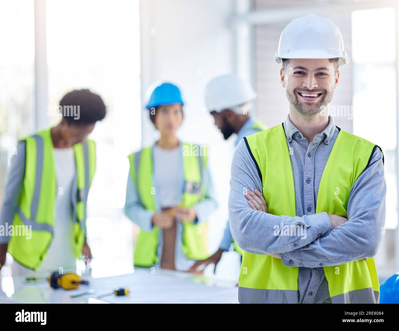 Construction worker, man portrait and arms crossed of engineer, builder ...