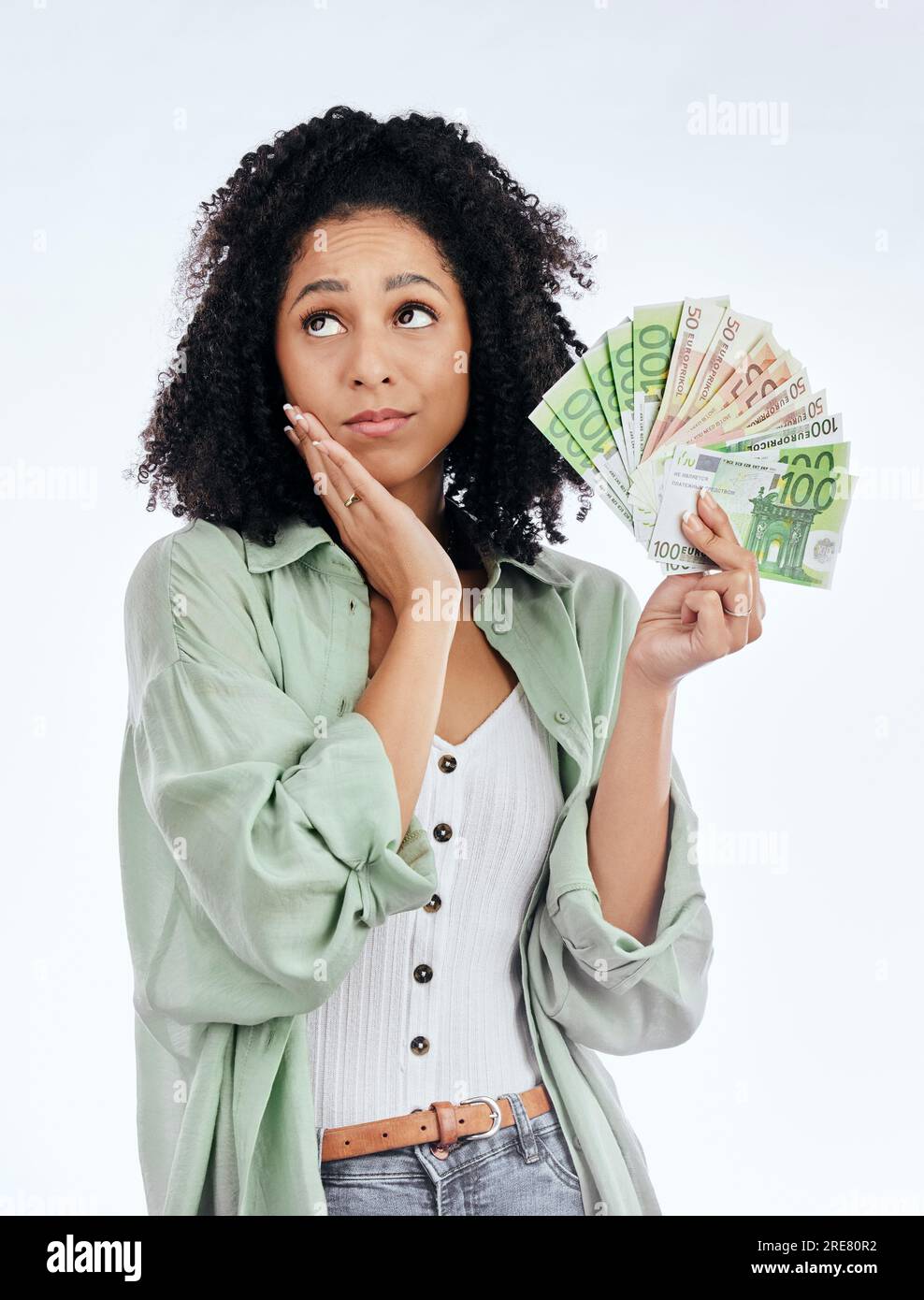 Woman money thinking bank notes hi-res stock photography and images - Alamy