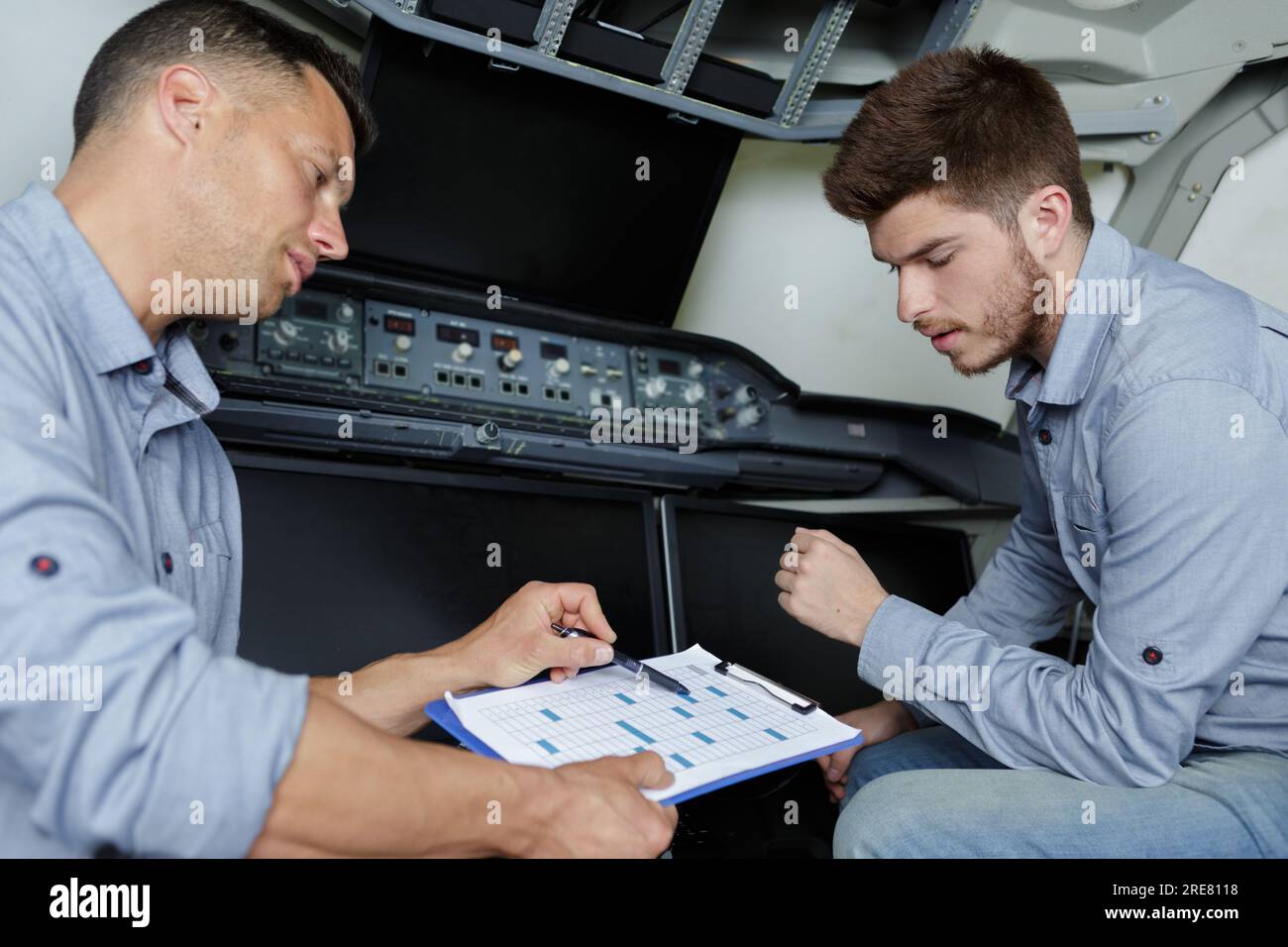 mechanics at work in aircraft Stock Photo - Alamy