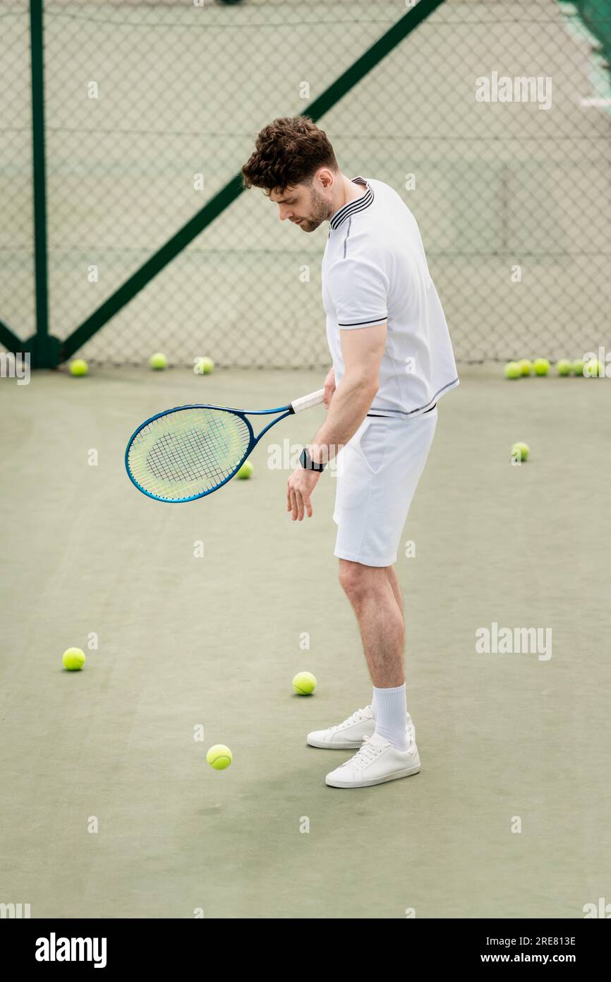 tennis balls around sportsman with racket on court, hobby and ...