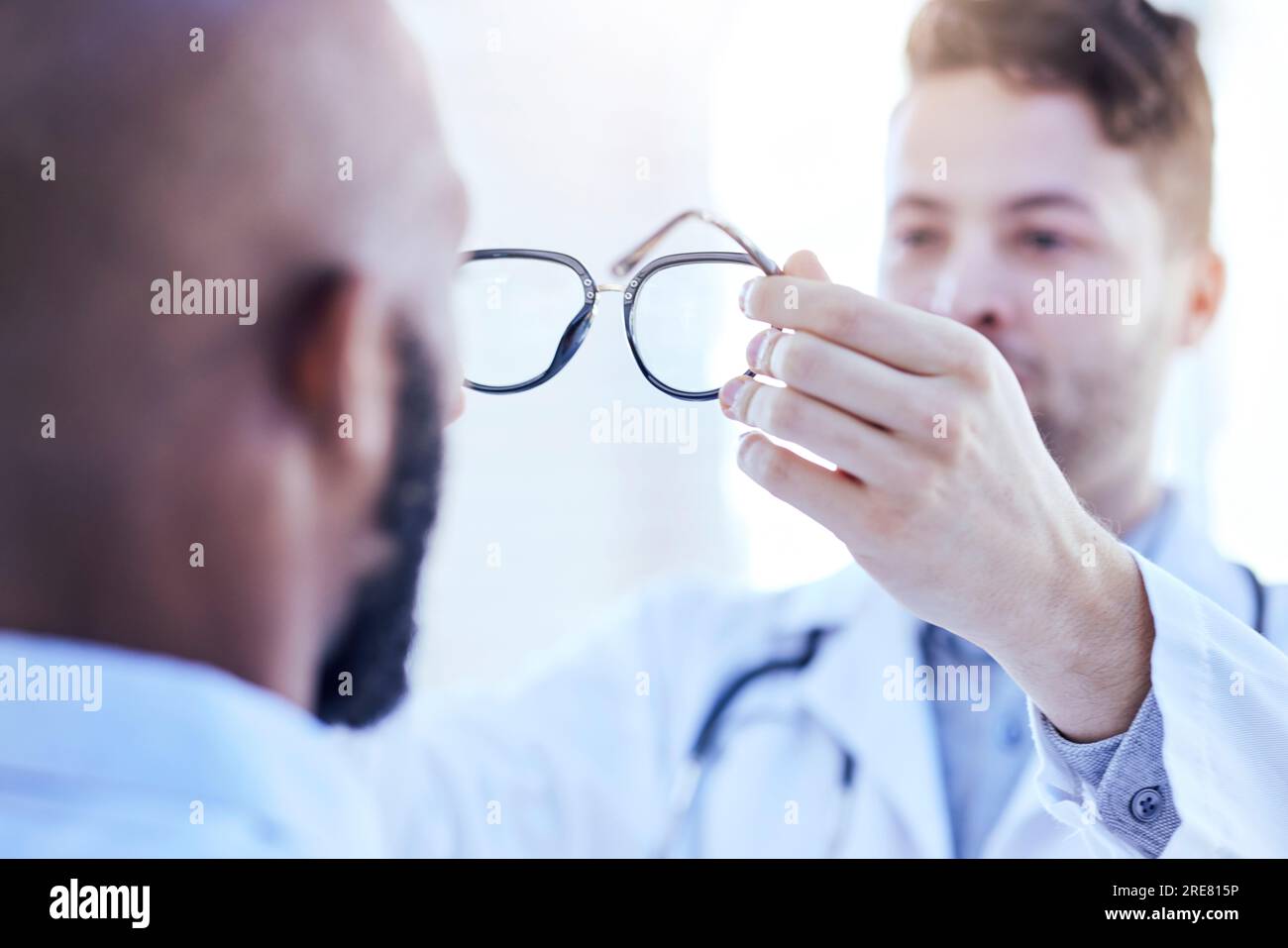 Hands, man and optometrist with glasses for eye support and lens check ...