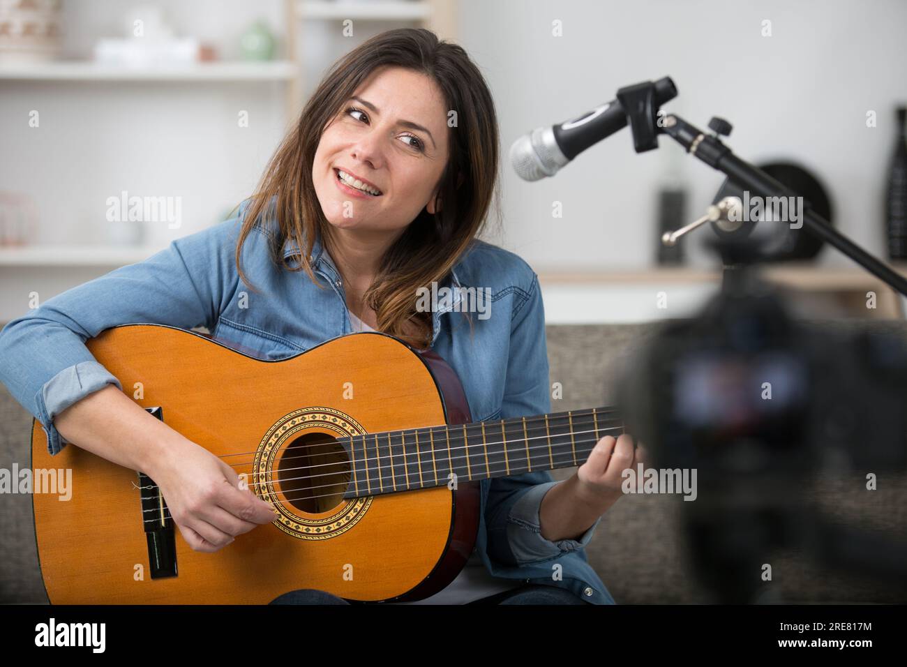 lovely female playing cover song Stock Photo - Alamy