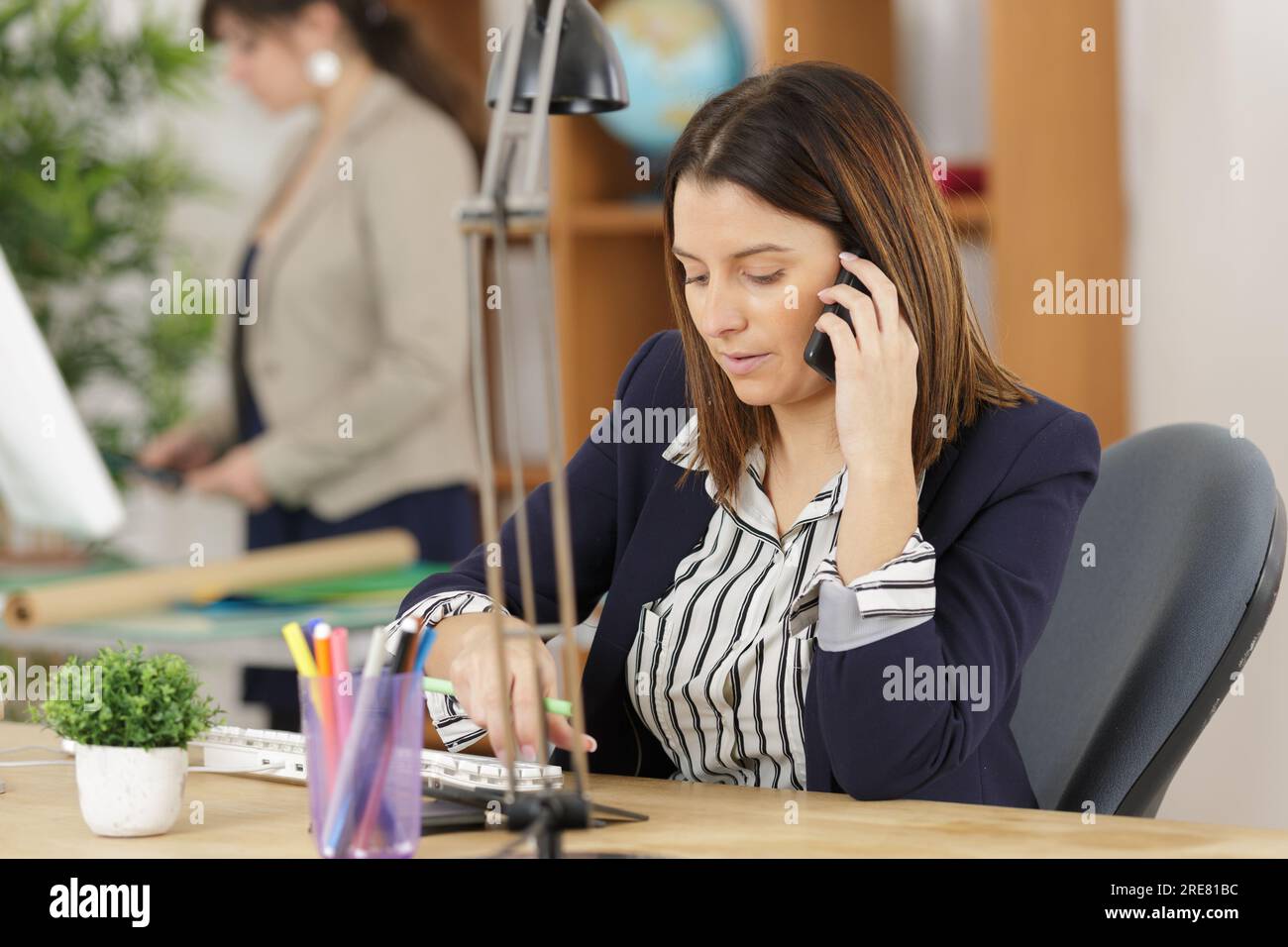 office worker businesswoman giving instructions via phone call Stock ...