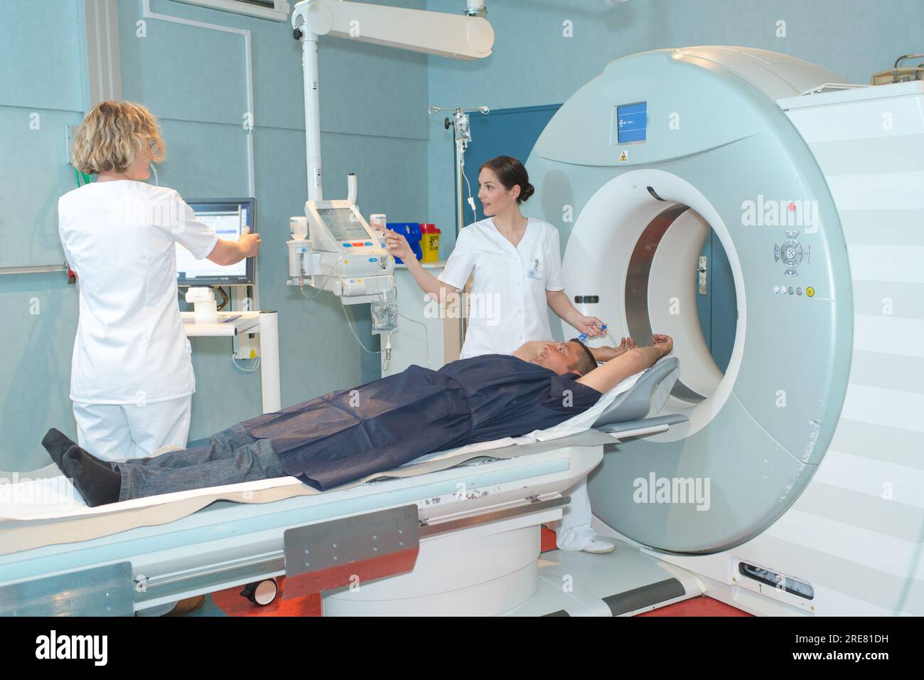 doctor pushing buttons on mri tomograph Stock Photo - Alamy