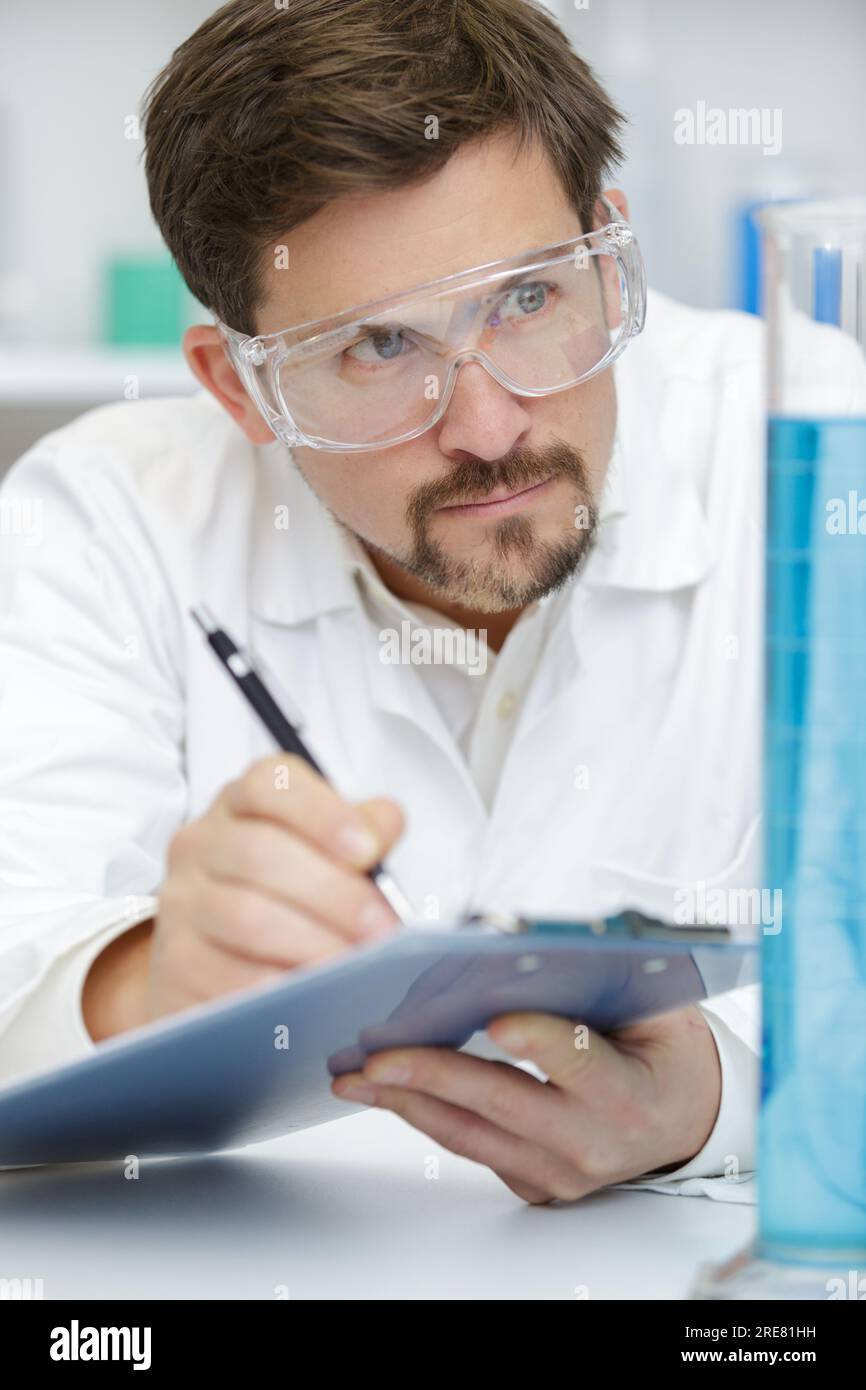 close up of scientist writing test results in lab Stock Photo - Alamy