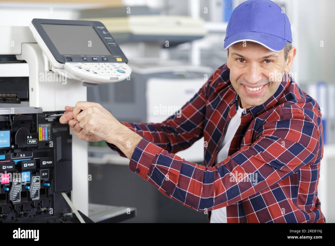 hardware repairman repairing broken printer fax machine Stock Photo - Alamy
