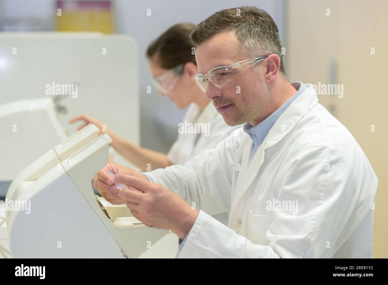 lab worker doing research chemical test concentrated Stock Photo - Alamy