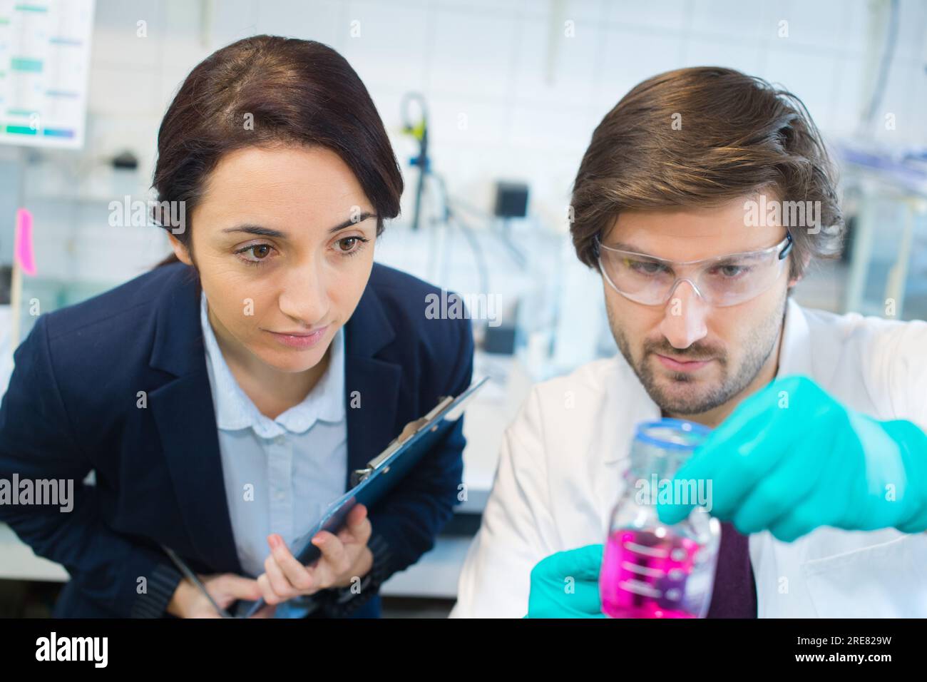pharmaceutical professionals observing a chemical Stock Photo - Alamy