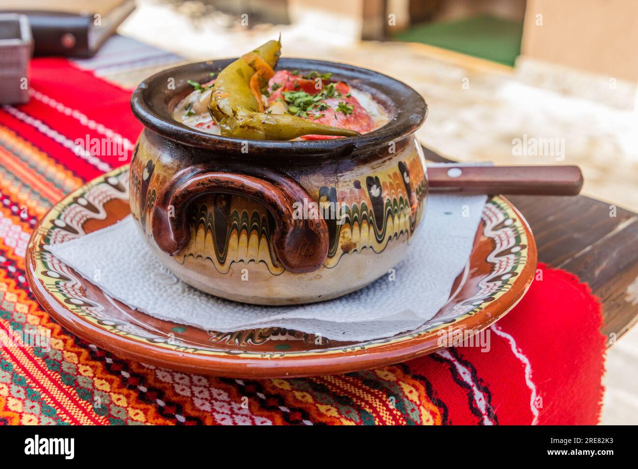 Typical dish of Bulgaria - Gyuveche. Meal baked in a clay pot Stock ...