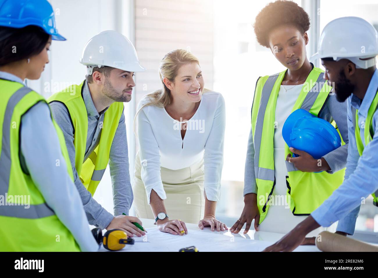 Construction team, business people and blueprint with planning, builder ...