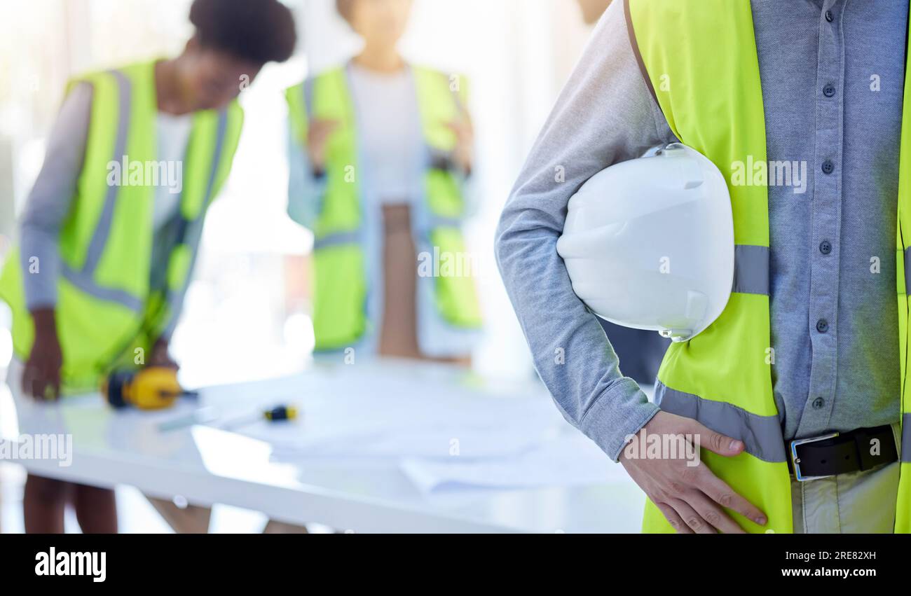 Construction worker, closeup and helmet with arm of engineer, builder ...