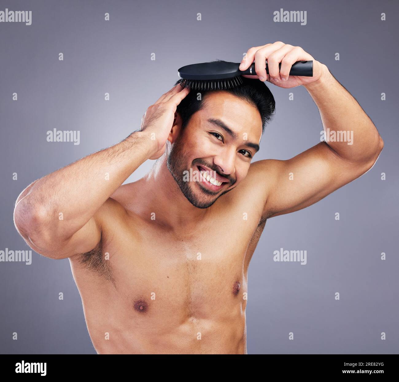 Portrait, beauty or happy man brushing hair in grooming with salon ...