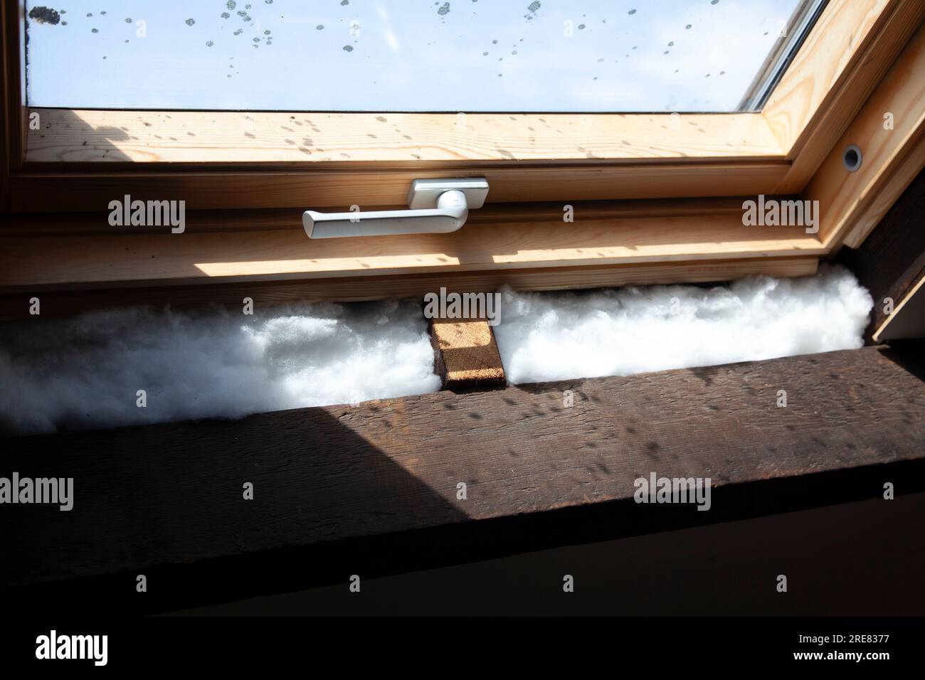 Fiberglass Cavity Insulation around Attic Window, UK Stock Photo - Alamy