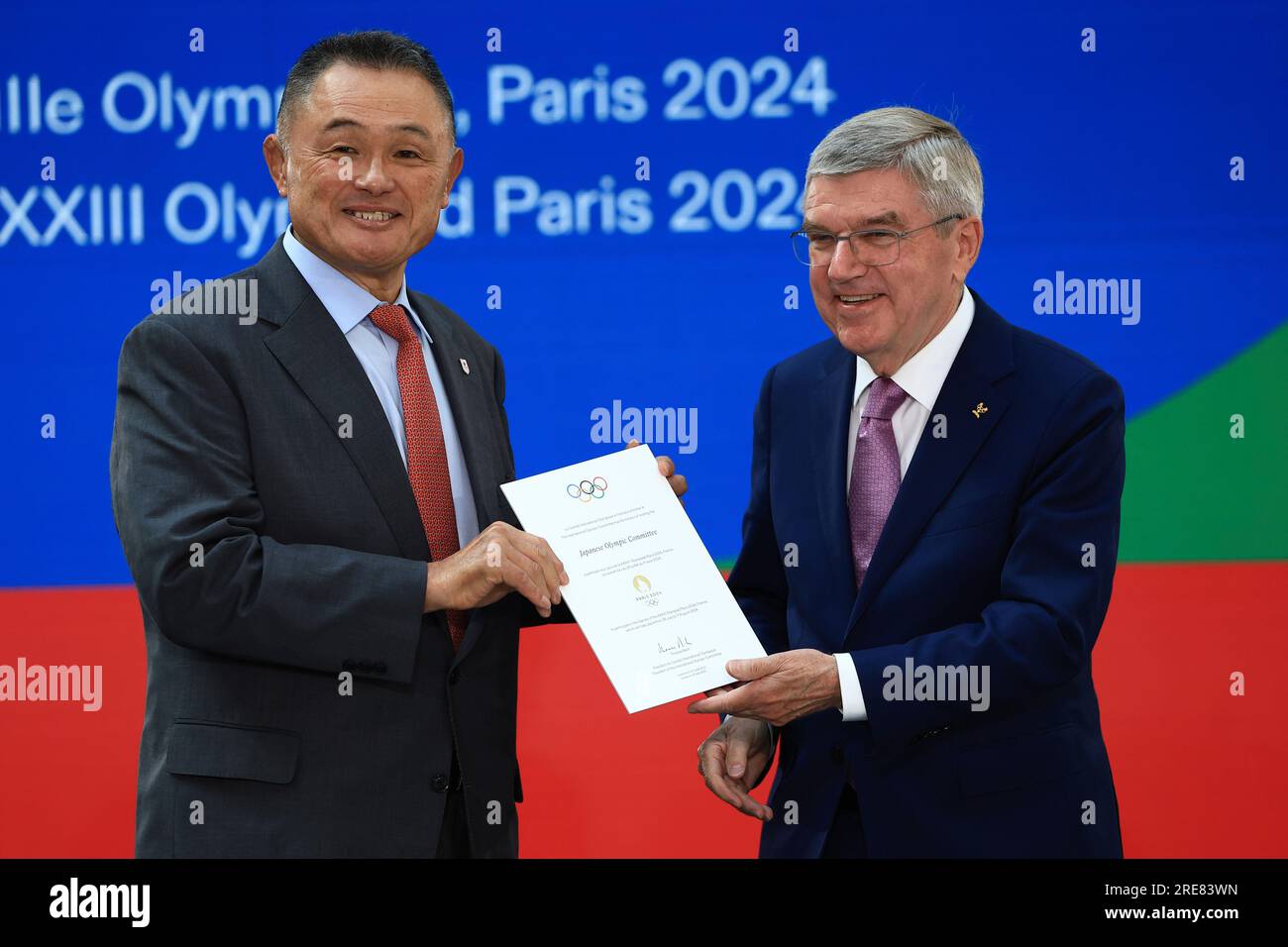 International Olympic Committee (IOC) president Thomas Bach, right ...