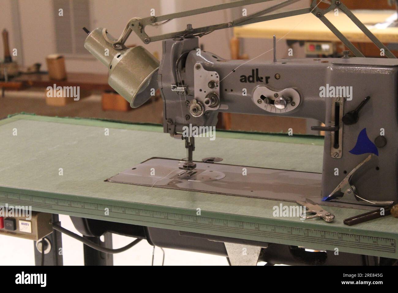 A photo of a sewing machine on a platform in a workshop Stock Photo - Alamy