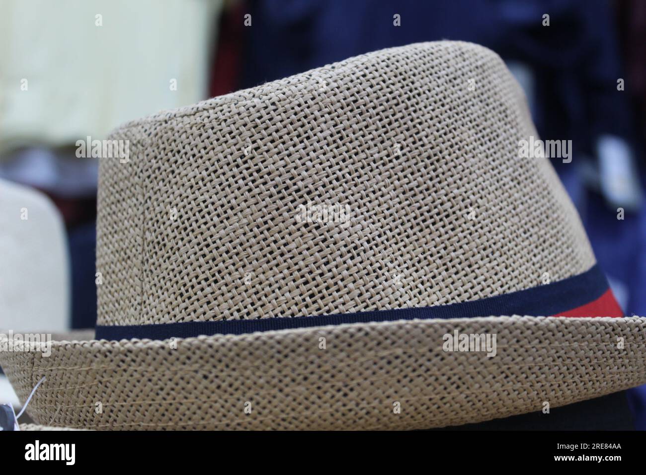 A close up photo of a straw hat displayed in a store Stock Photo - Alamy
