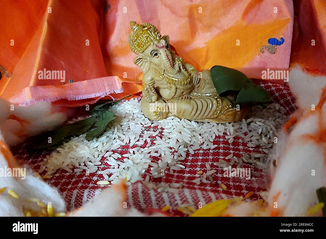 View of idol of Lord Ganesha reclining gracefully on decorated platform ...