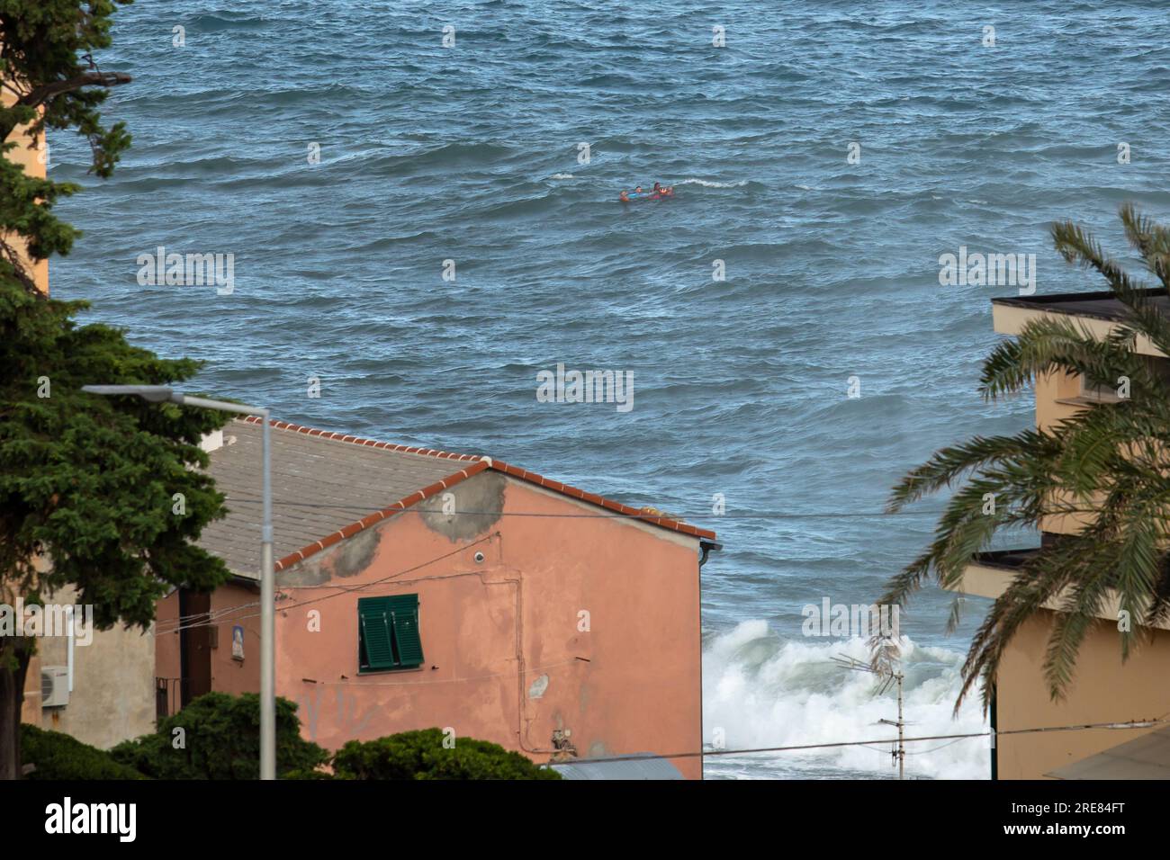 Helicopter rescue swimmers of Vigili del Fuoco assist a group of ...